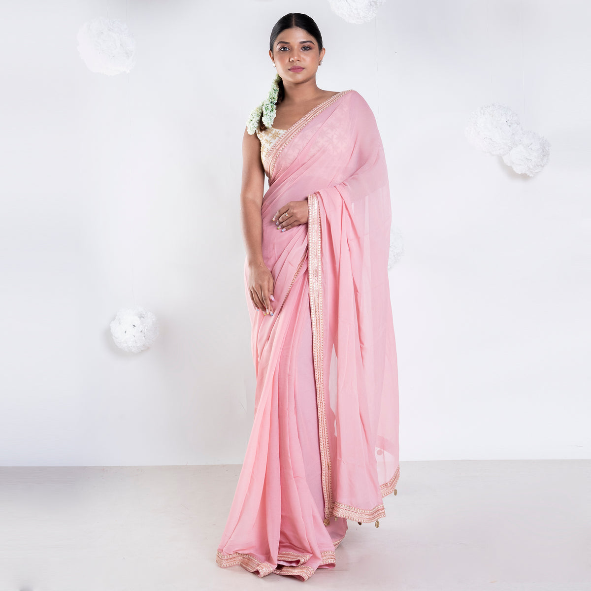 Pink color Georgette saree with golden embroidered border – Boveee